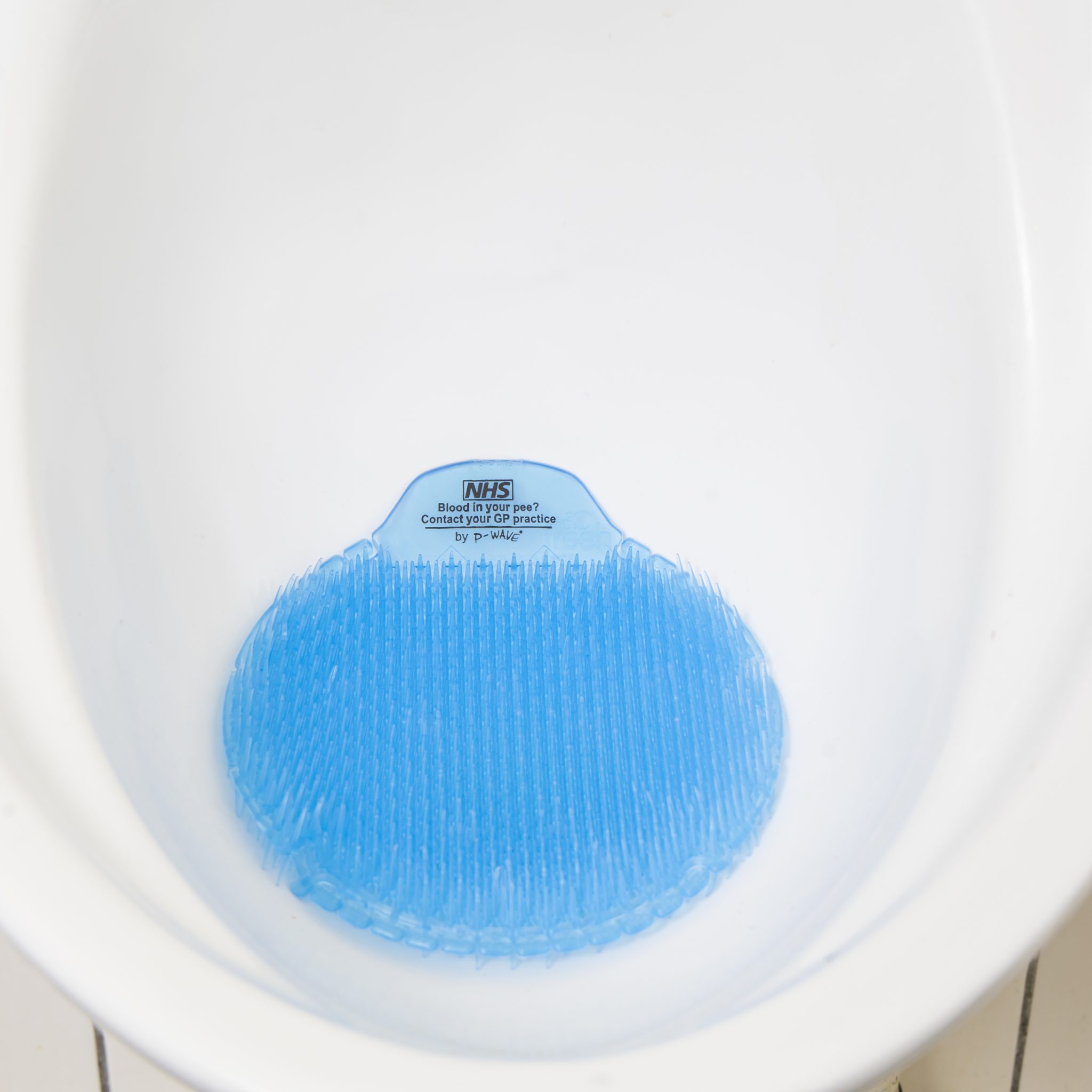 Cancer signs on urinal mats in pubs and football grounds, as part of ...
